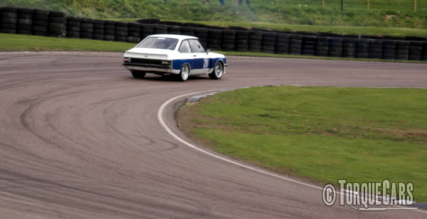 The racing line and high speed cornering techniques.